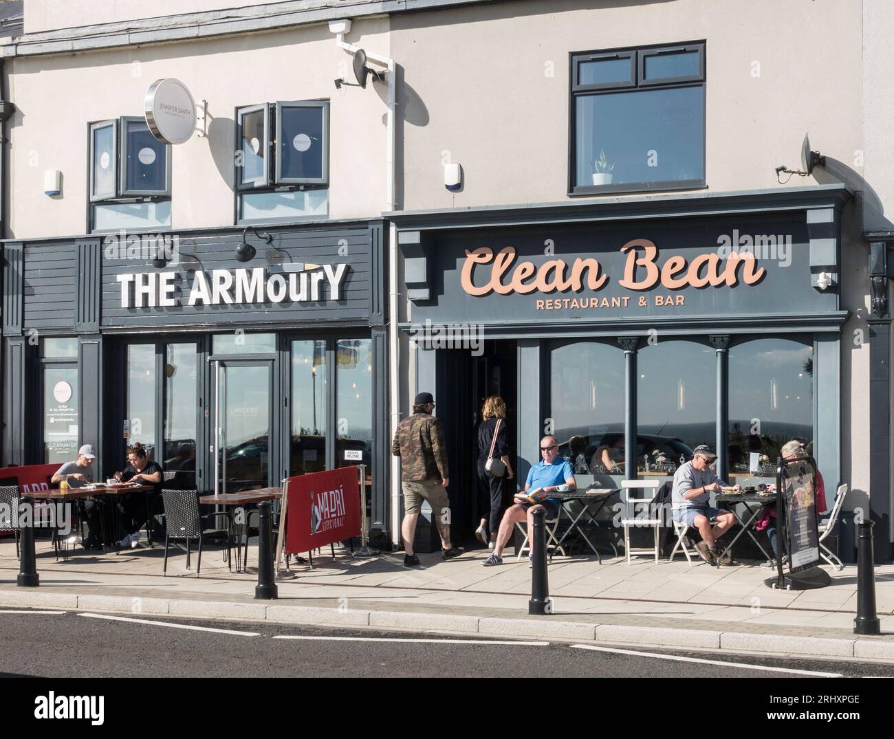 People sitting outside a café on Seaham seafront in Co. Durham, England ...