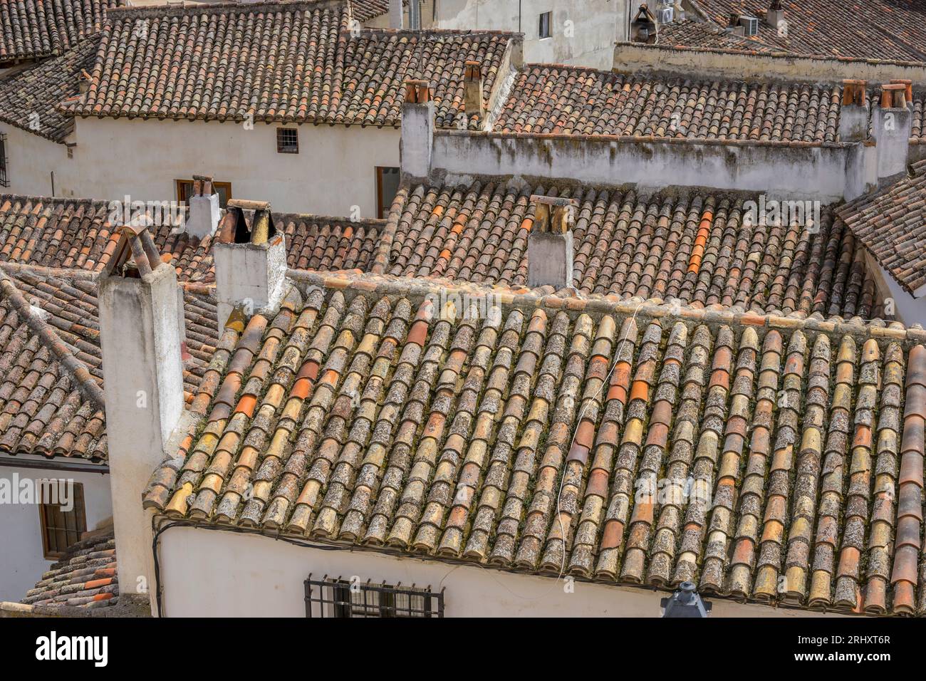 traditional homes, Spanish rooftops, local life in a historic plaza ...