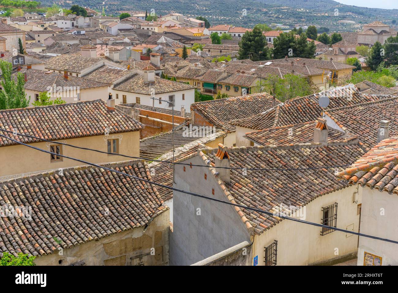 traditional homes, Spanish rooftops, local life in a historic plaza ...