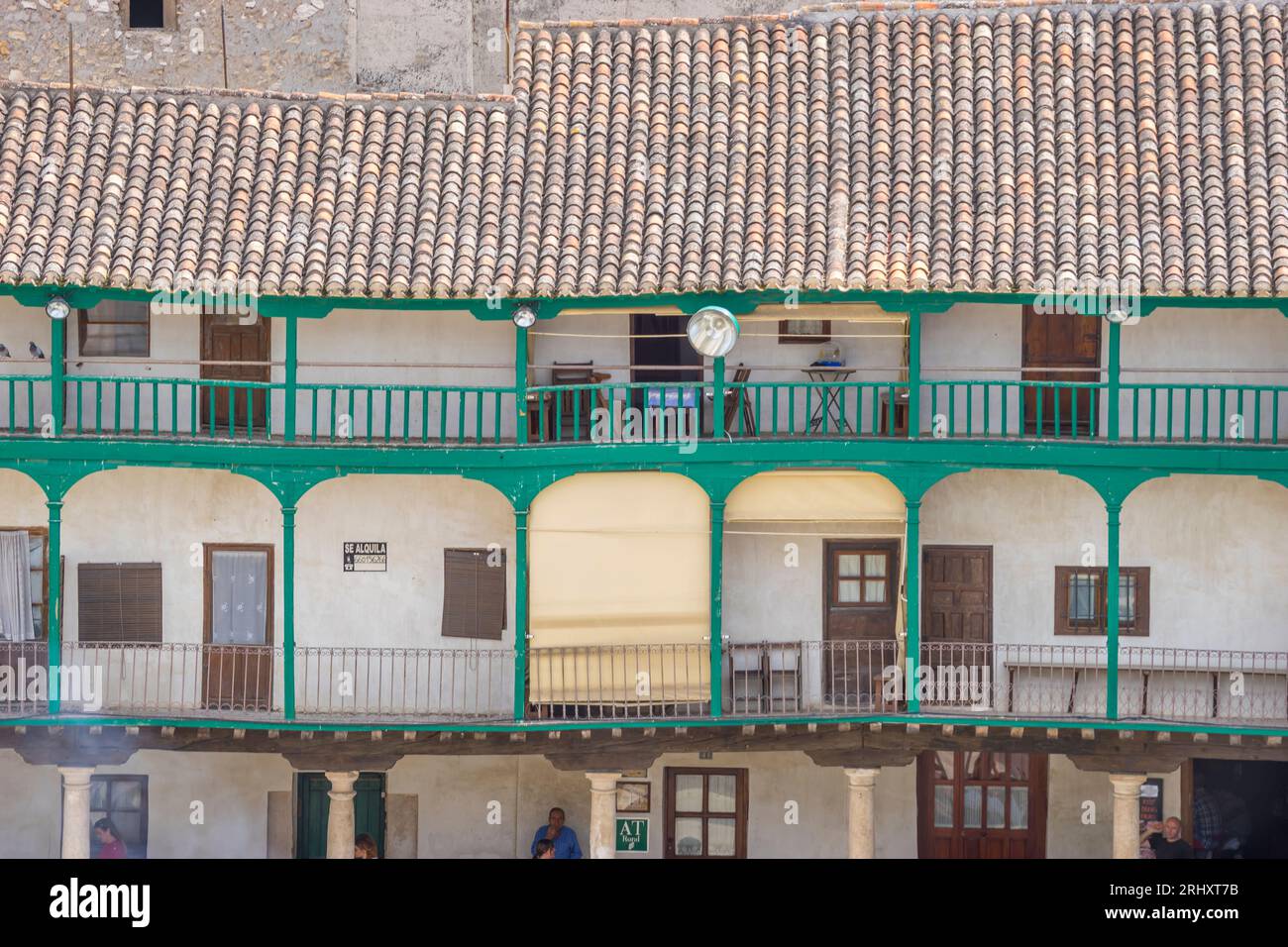 traditional homes, Spanish rooftops, local life in a historic plaza ...