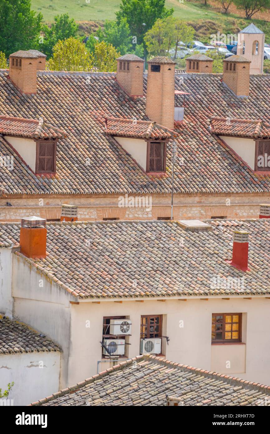 traditional homes, Spanish rooftops, local life in a historic plaza ...