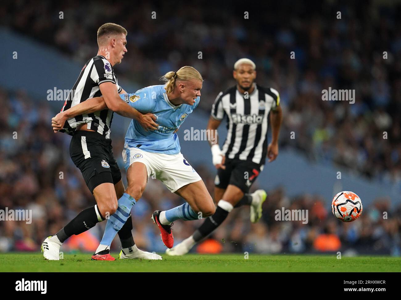 Newcastle United's Sven Botman pulls back on Manchester City's Erling ...