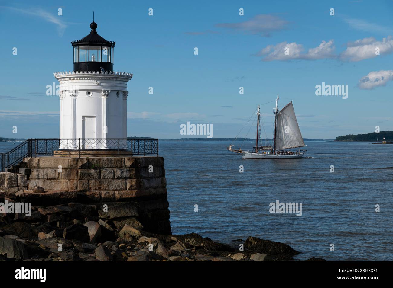 An authentic two-masted schooner sailboat passes by Portland Breakwater ...