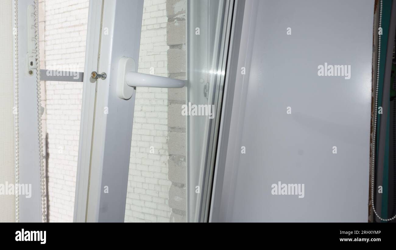 The double-glazed window is white with roller blinds. The window is not ...