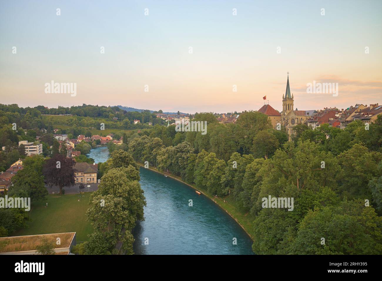 View of the Aar river at sunset as it passes through the city of Bern ...
