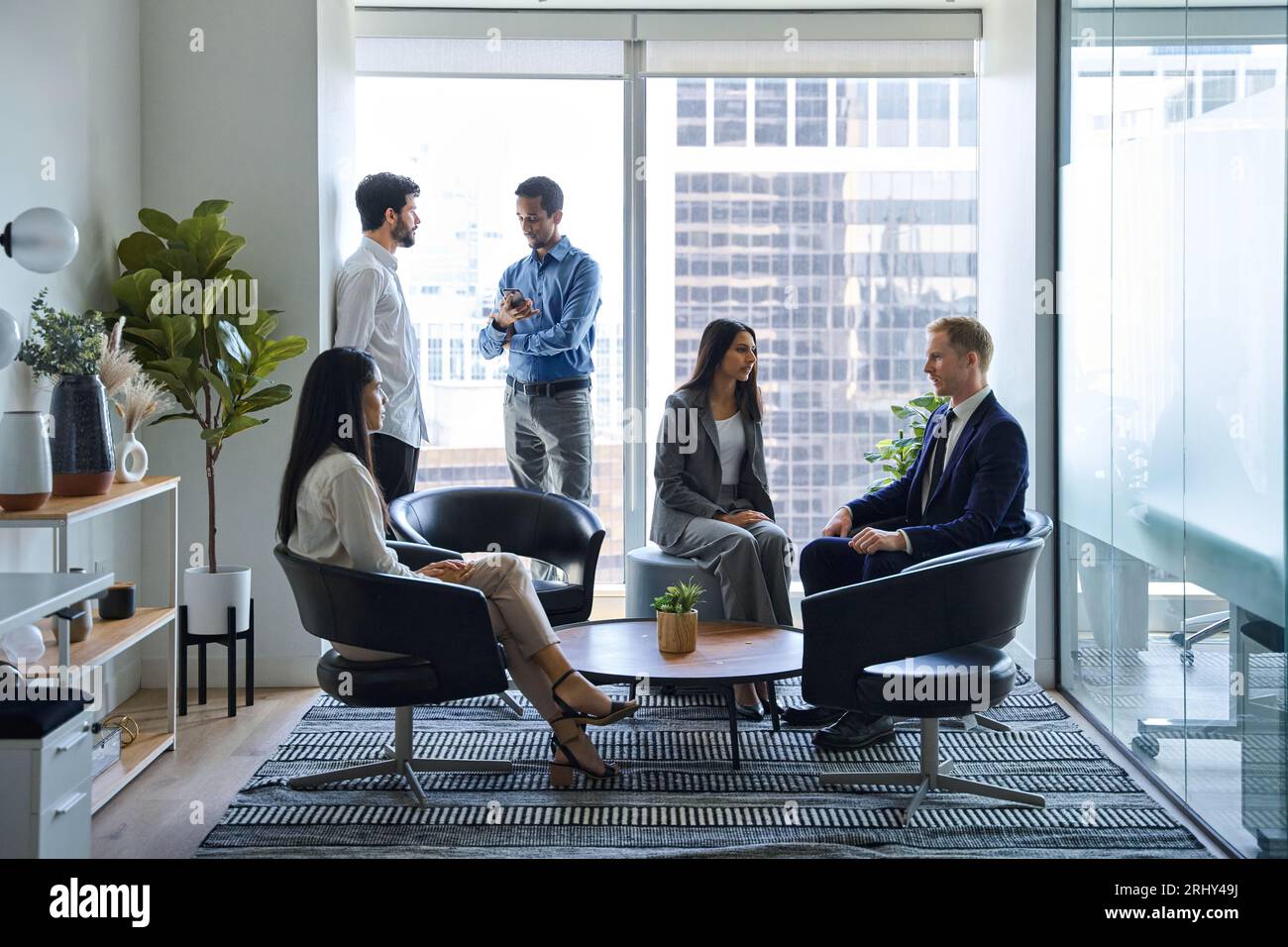 Busy professional team business people talking in office lobby ...