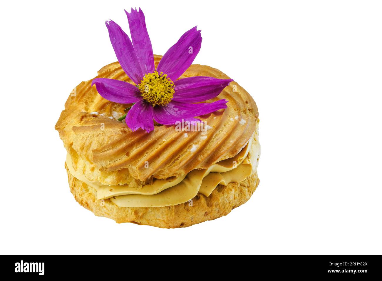 Eclair with butter cream decorated with a flower on a white background ...