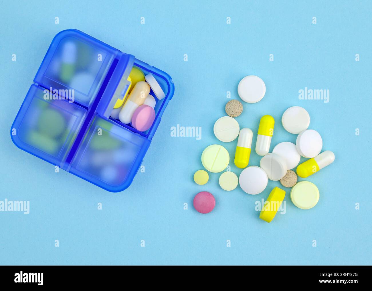 Plastic container for pills top view. Blue pill organizer with 4 ...