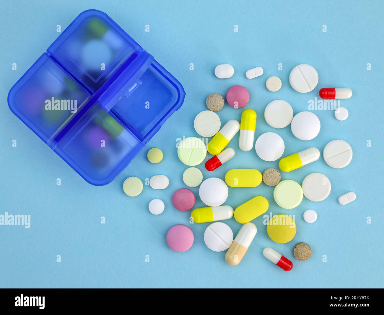 Plastic container for pills top view. Blue pill organizer with 4 ...