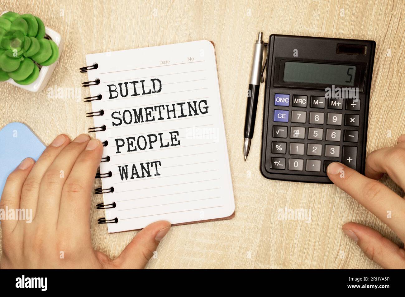 Build something people want.text on white notepad on craft background ...