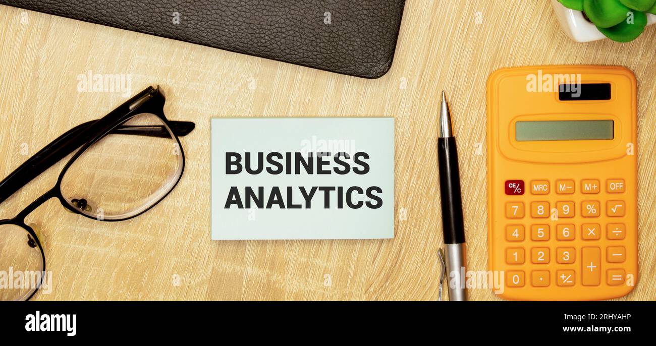 Business Analytics Text Concept Office Workplace Table With Calculator Graphs Reports And