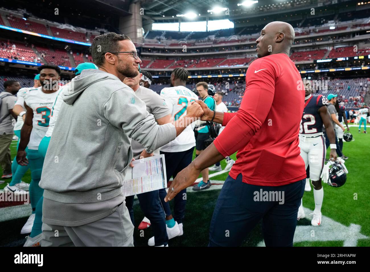 Miami Dolphins head coach Mike McDaniel, left, and Houston Texans head ...