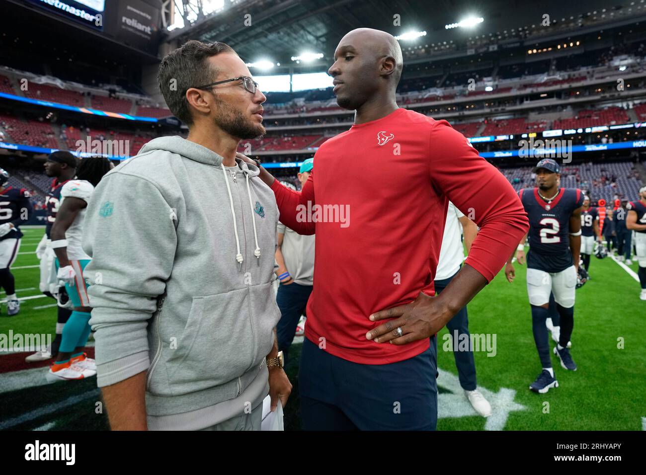 Miami Dolphins head coach Mike McDaniel, left, and Houston Texans head ...