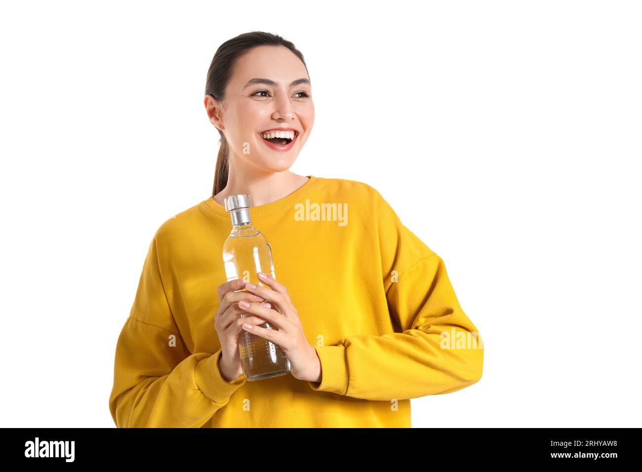 Young woman with bottle of vodka on white background Stock Photo - Alamy