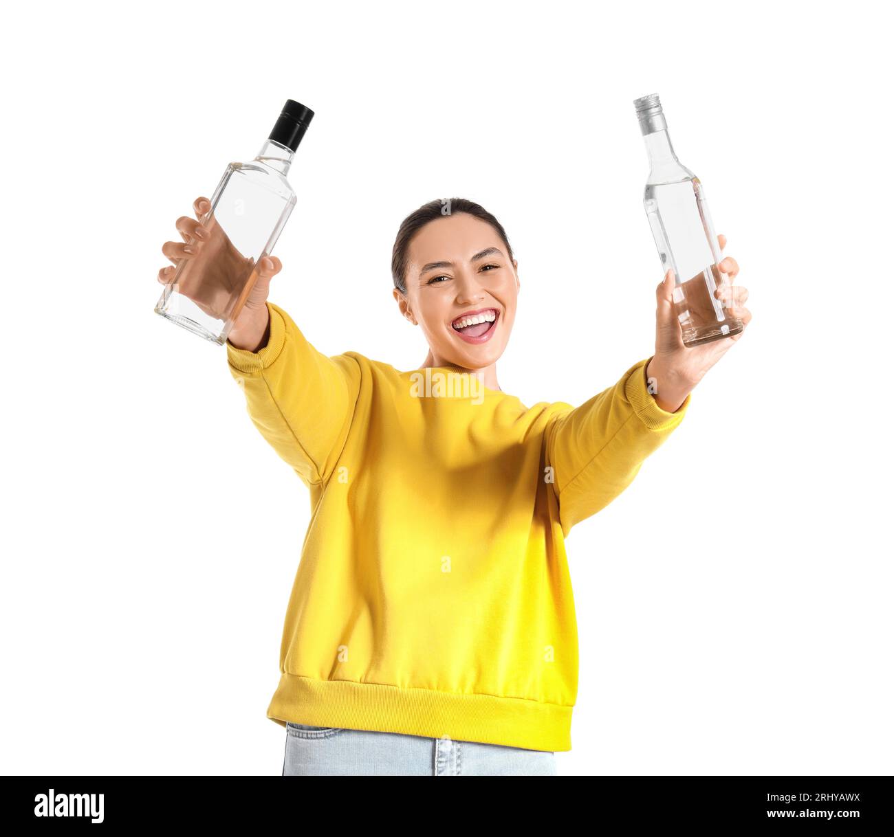 Young woman with bottles of vodka on white background Stock Photo - Alamy