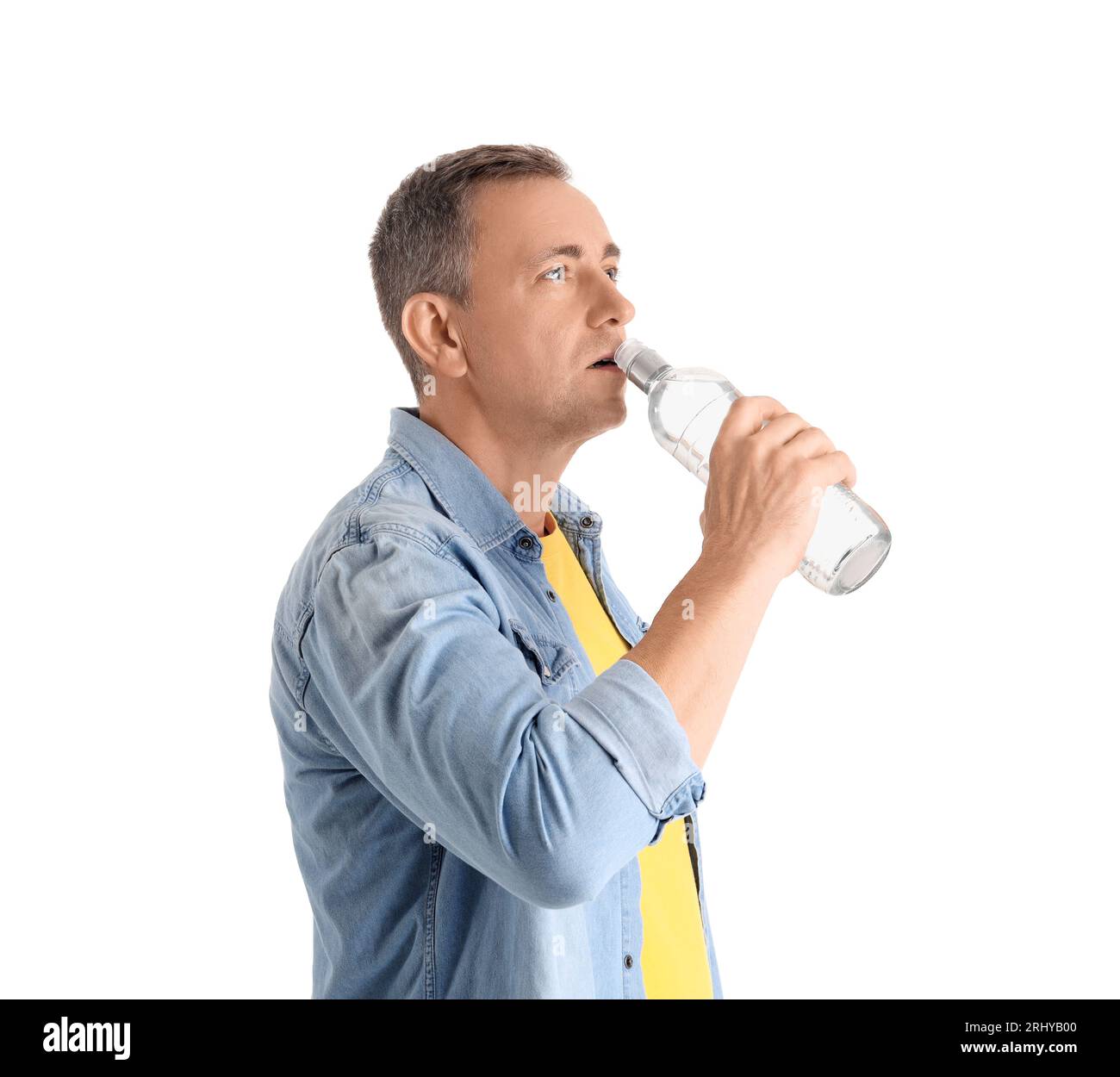 Mature man drinking vodka on white background Stock Photo - Alamy