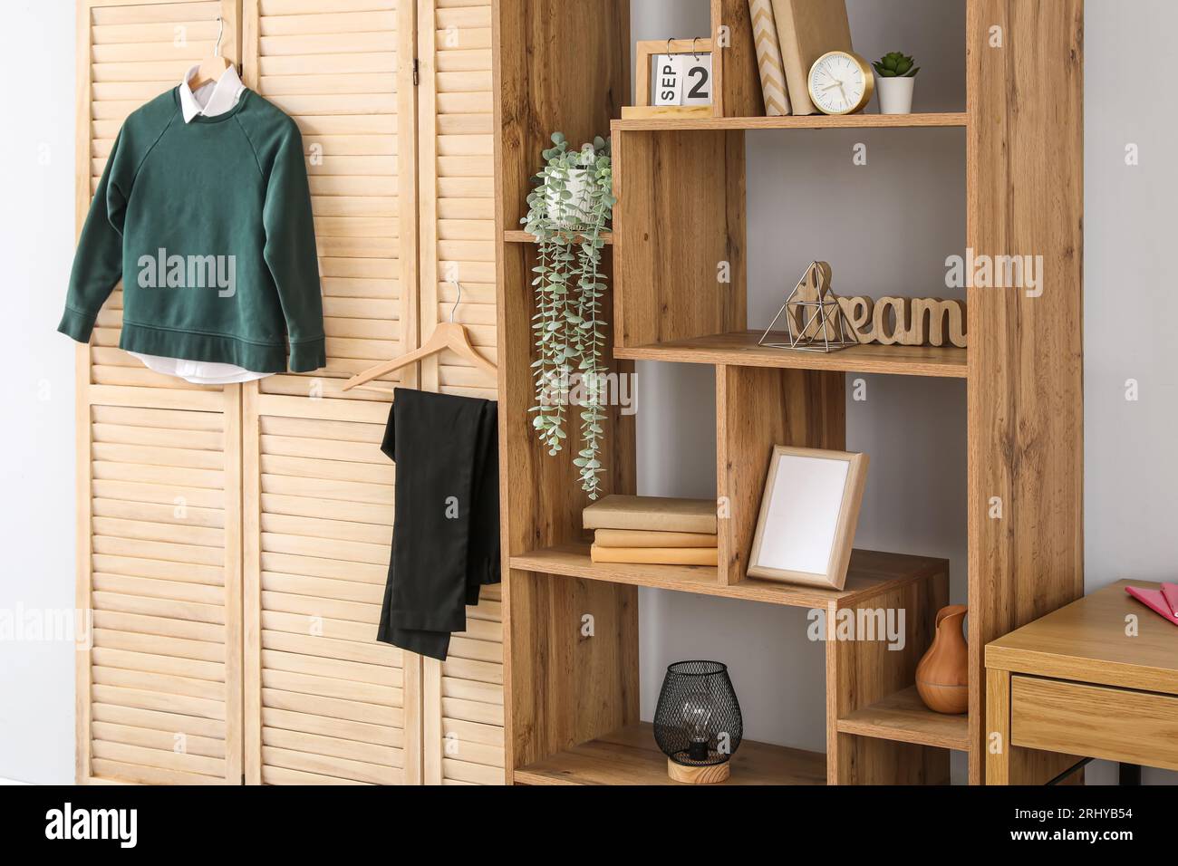 Interior of stylish modern room with school uniform Stock Photo - Alamy