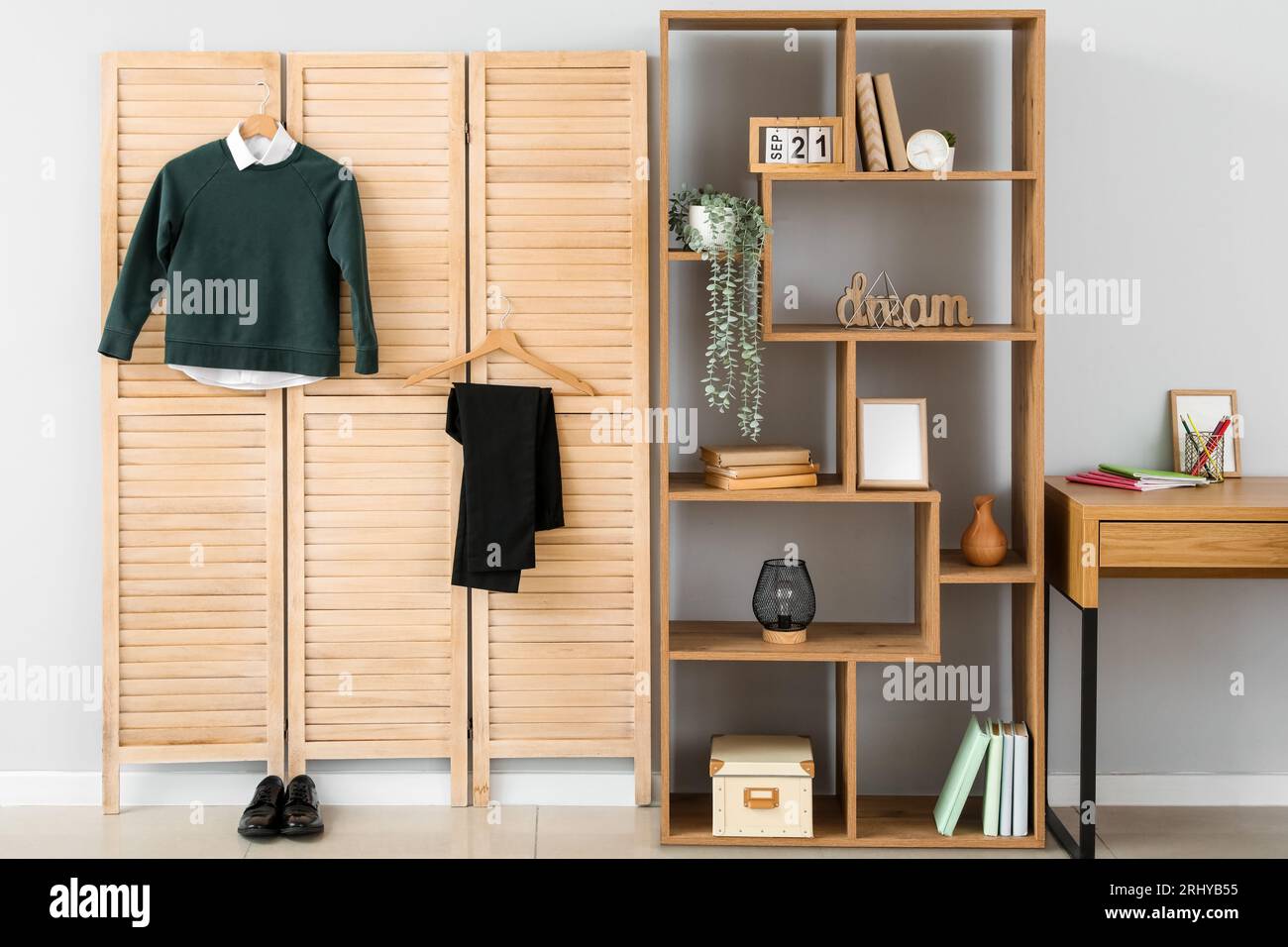Interior of stylish modern room with school uniform Stock Photo - Alamy