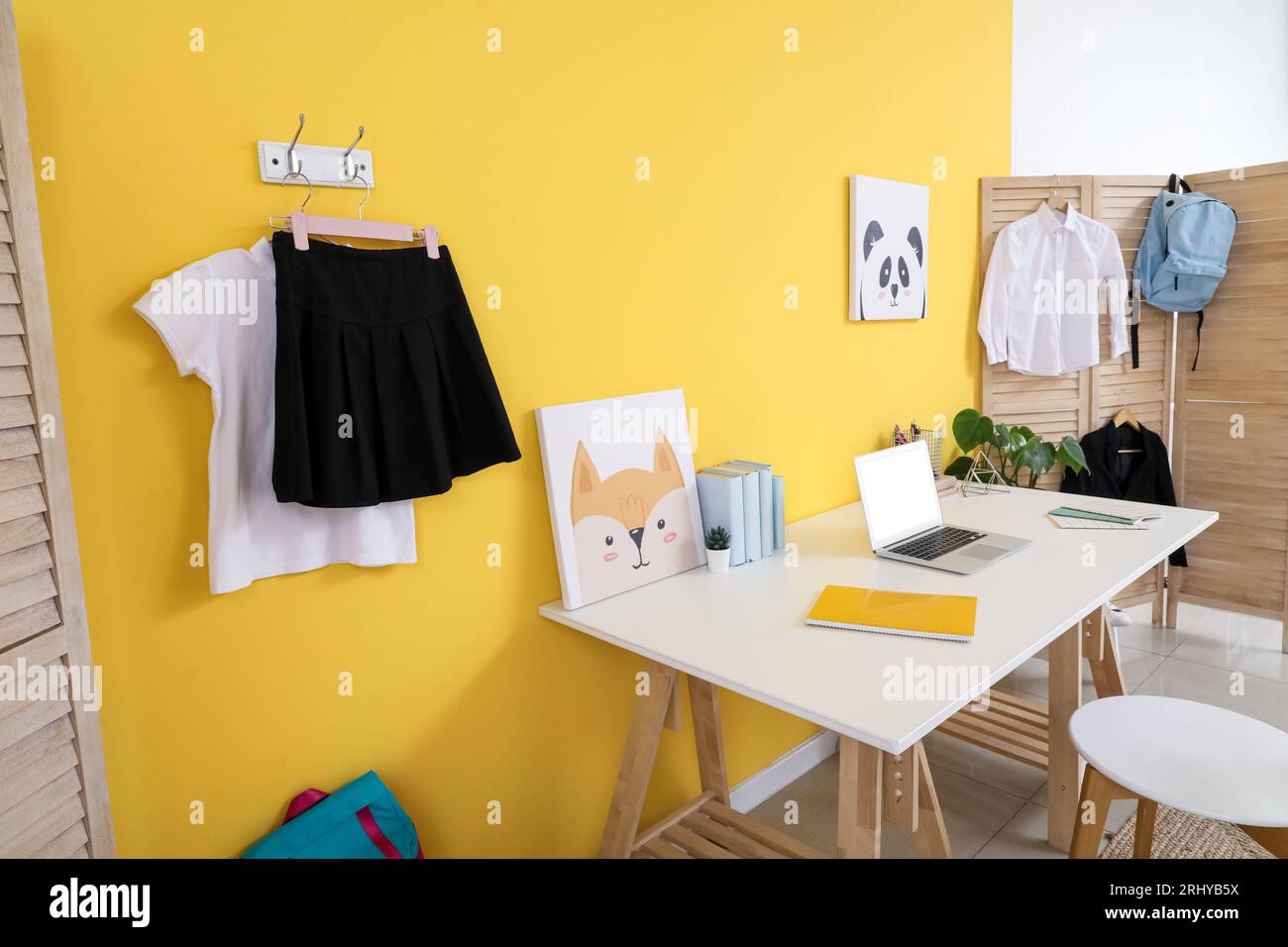 Interior of modern room with workplace and stylish school uniform Stock ...