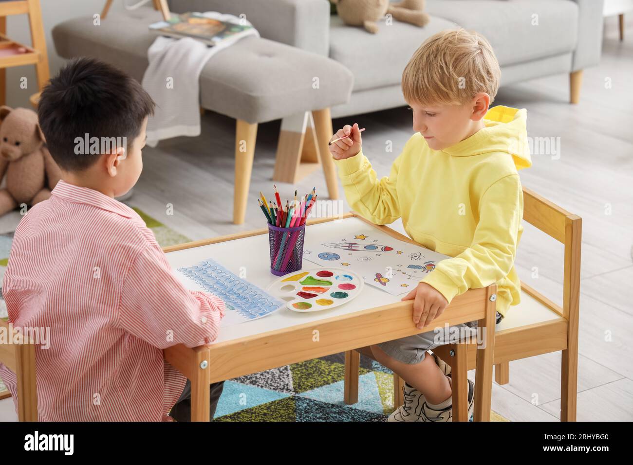 Cute little boys drawing at home Stock Photo - Alamy
