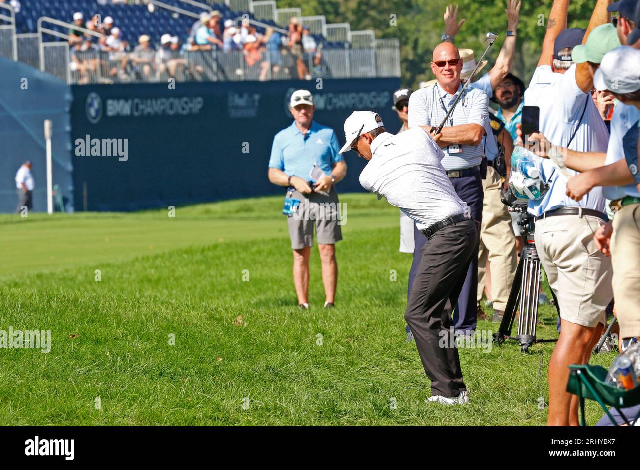 OLYMPIA FIELDS, IL - AUGUST 19: PGA golfer Rickie Fowler hits out of the rough on the 18th hole ...