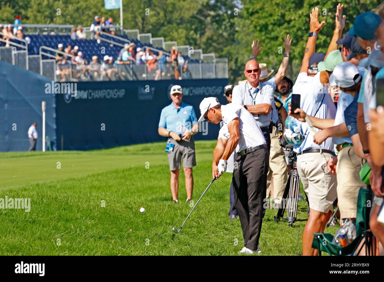 OLYMPIA FIELDS, IL - AUGUST 19: PGA golfer Rickie Fowler hits out of the rough on the 18th hole ...