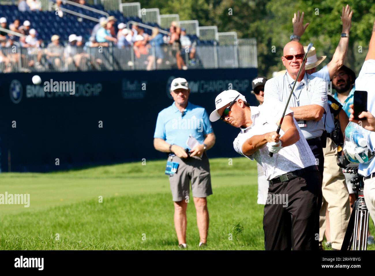 OLYMPIA FIELDS, IL - AUGUST 19: PGA golfer Rickie Fowler hits out of the rough on the 18th hole ...