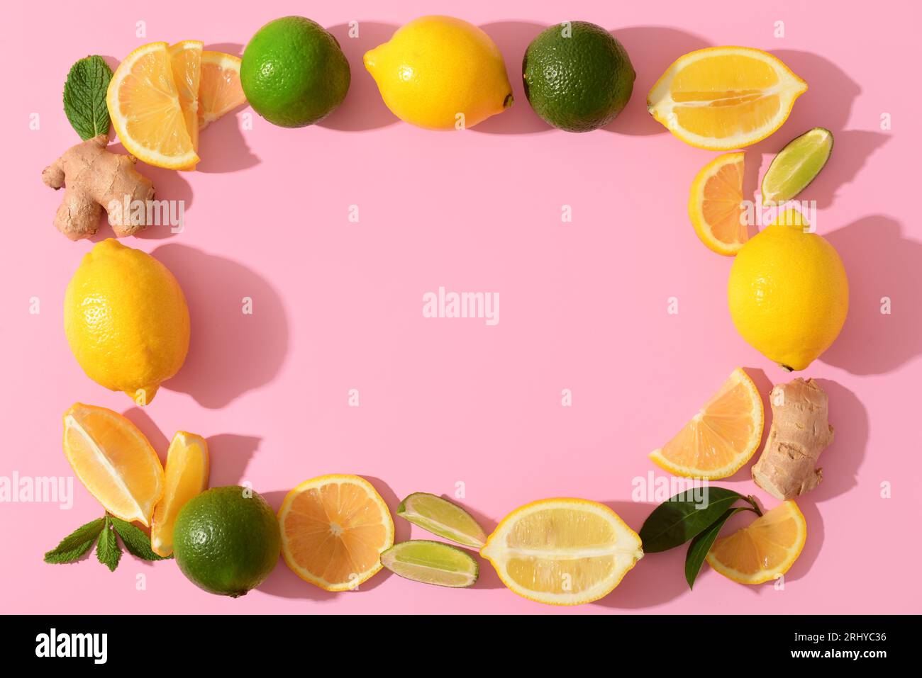 Frame made of ingredients for preparing lemonade on pink background ...