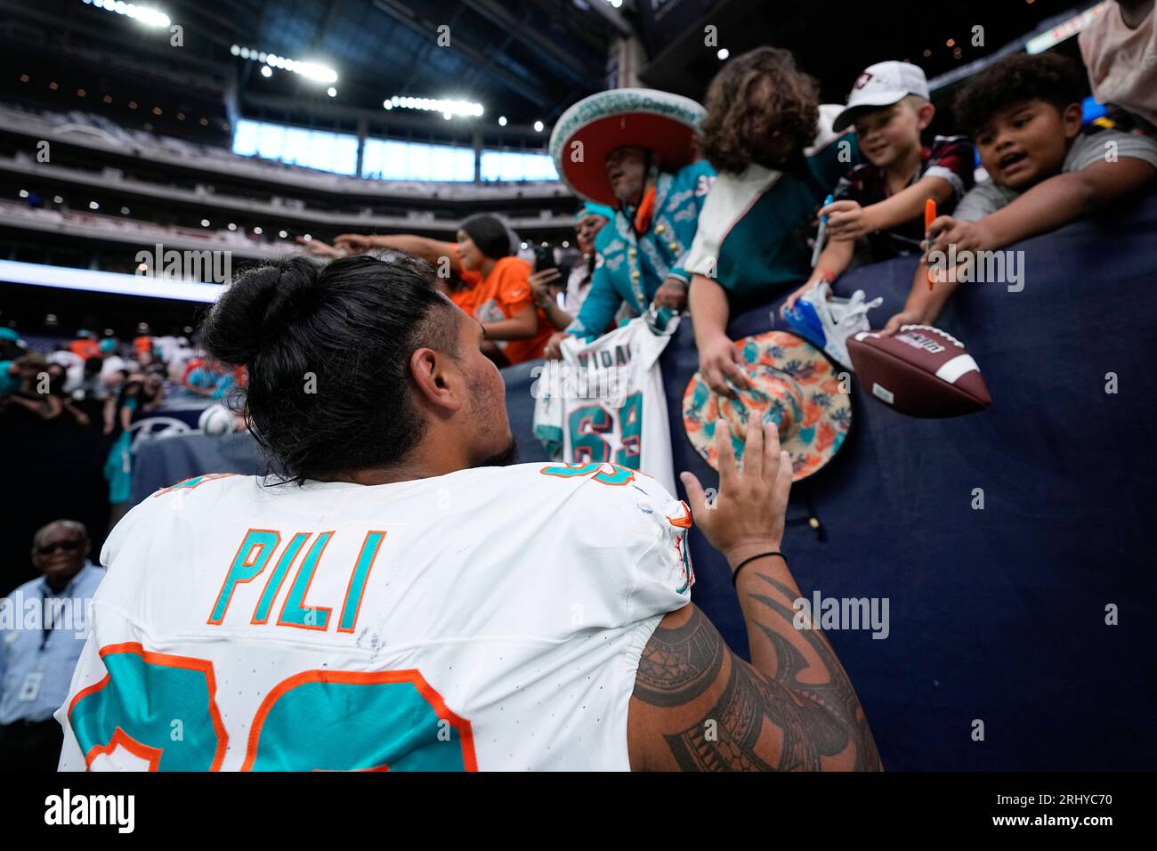 Miami Dolphins defensive tackle Brandon Pili signs autographs following ...