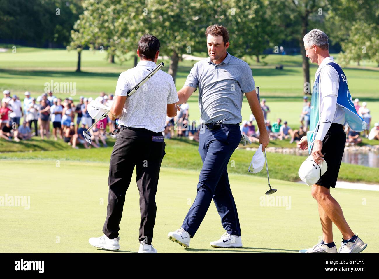 OLYMPIA FIELDS, IL - AUGUST 19: PGA golfer Scottie Scheffler shakes hands with Rickie Fowler ...