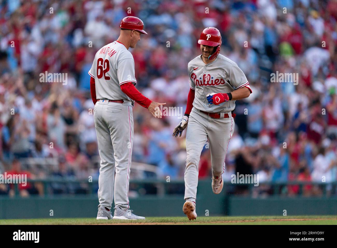 Philadelphia Phillies' Trea Turner, right, celebrates with third base ...