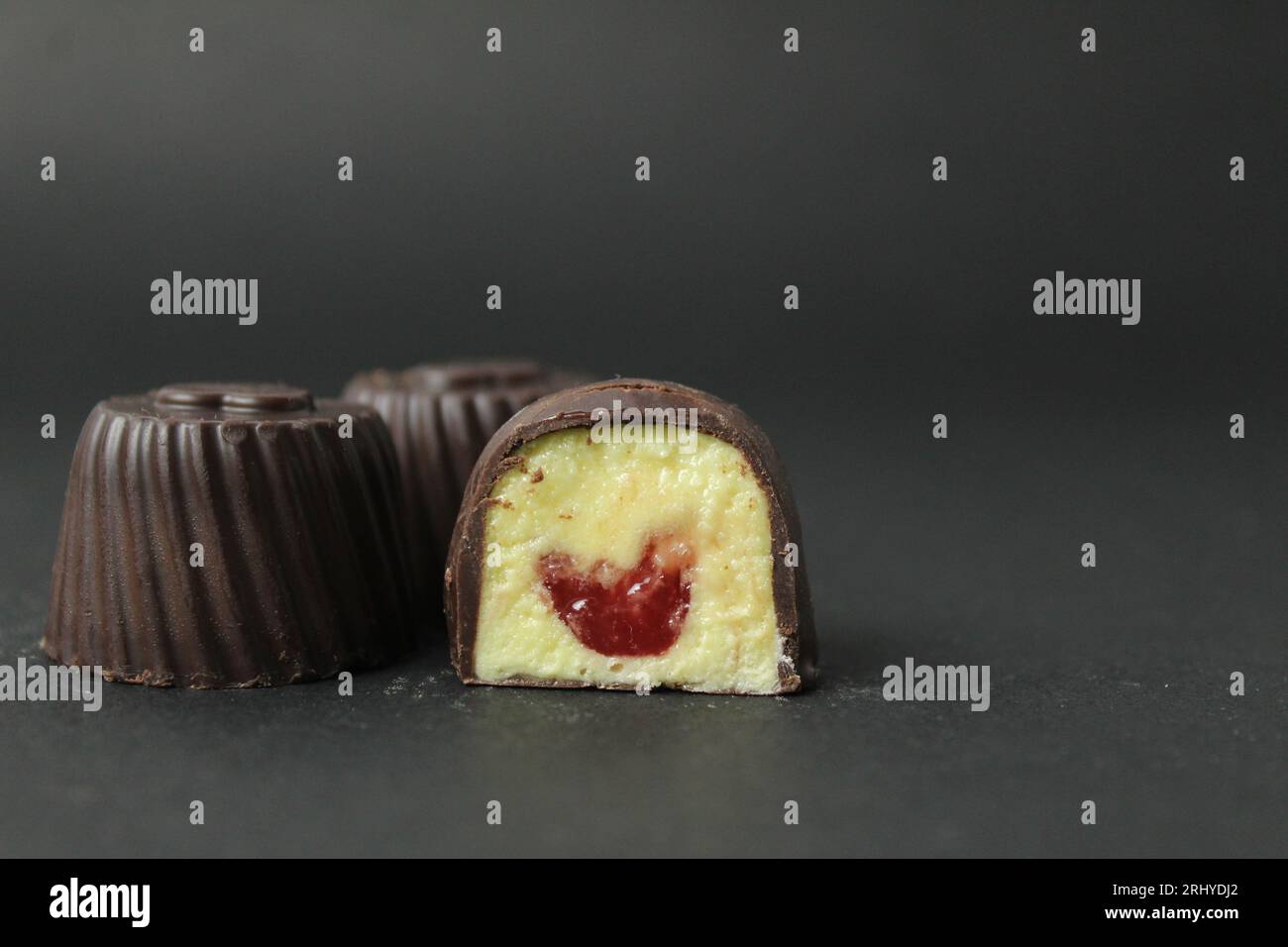 Chocolate case candy filled with mango, passion fruit, cherry ...