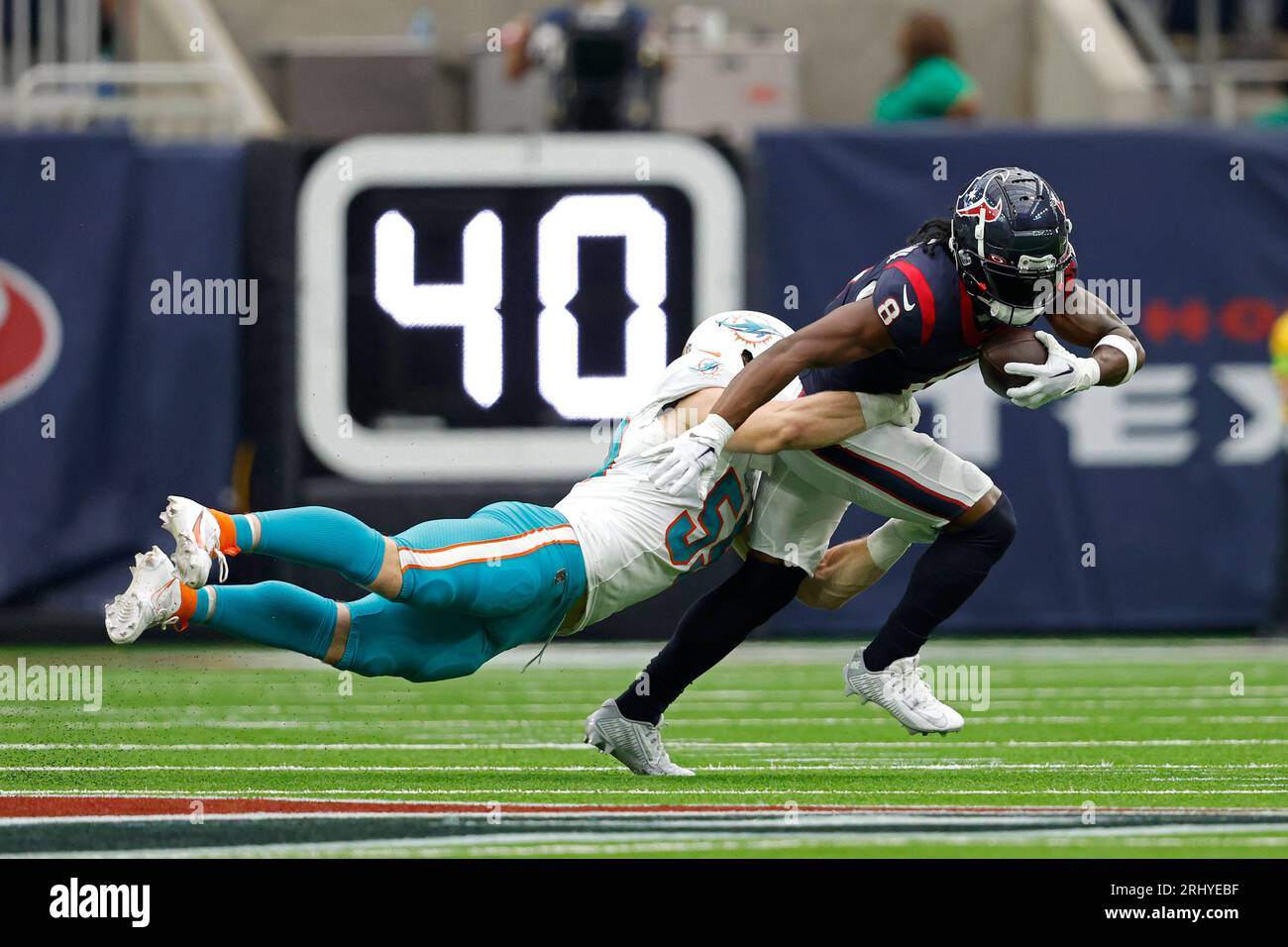 Houston Texans wide receiver John Metchie III (8) is defended by Miami ...