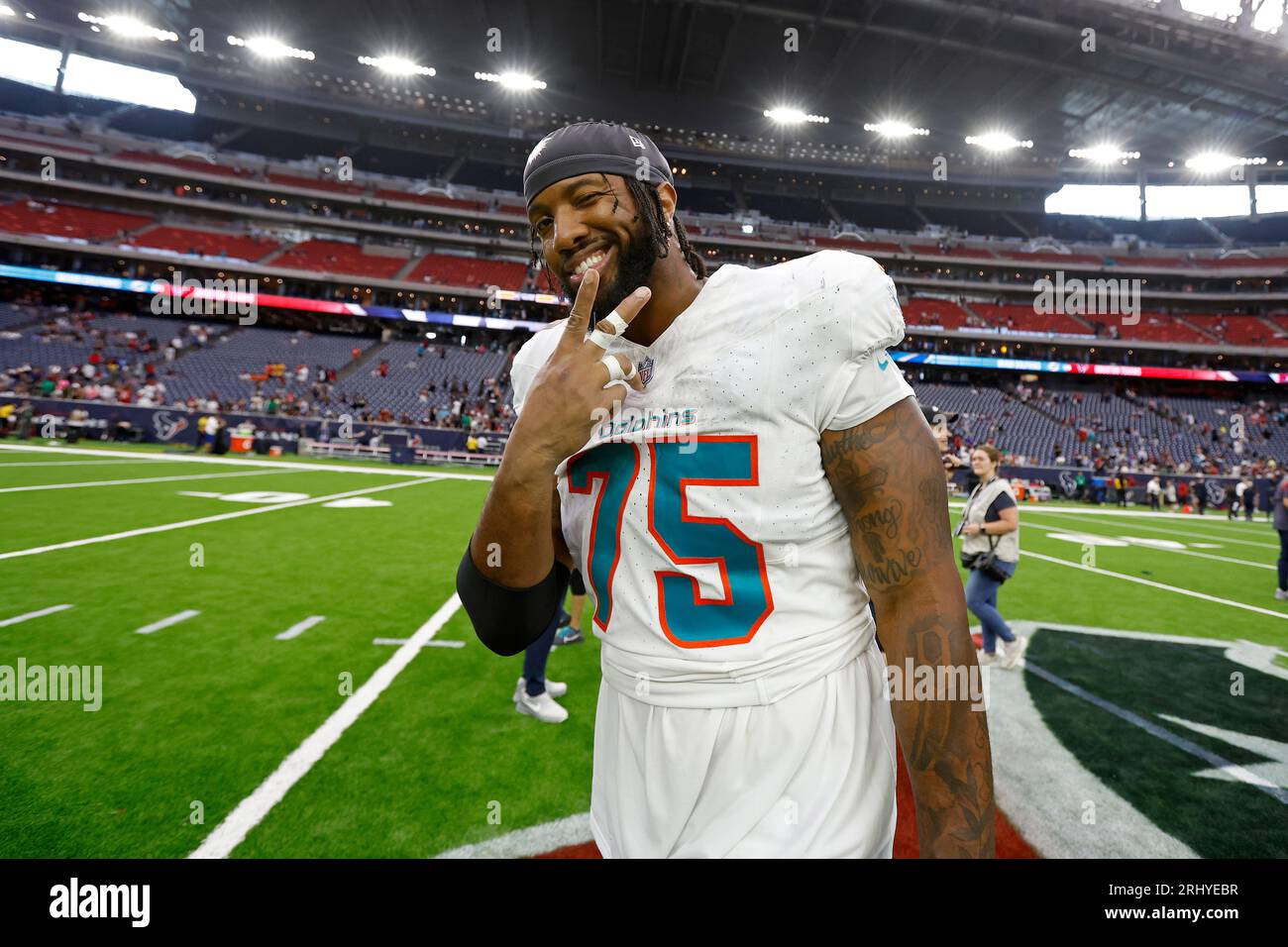 Miami Dolphins offensive tackle James Tunstall (75) reacts after an NFL ...