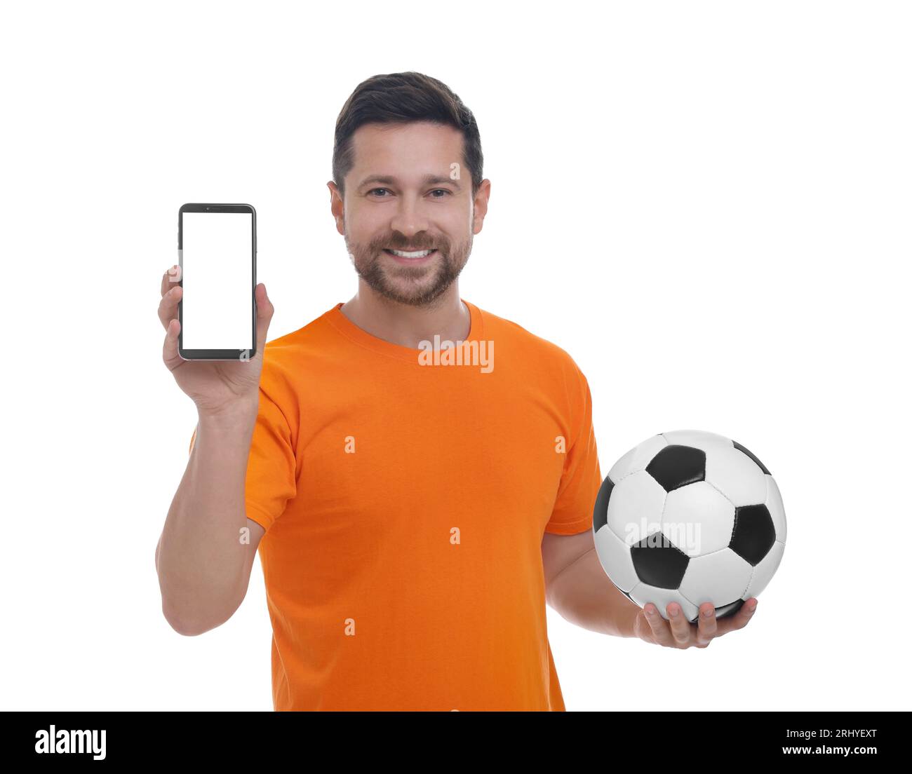 Happy sports fan with ball and smartphone on white background Stock ...
