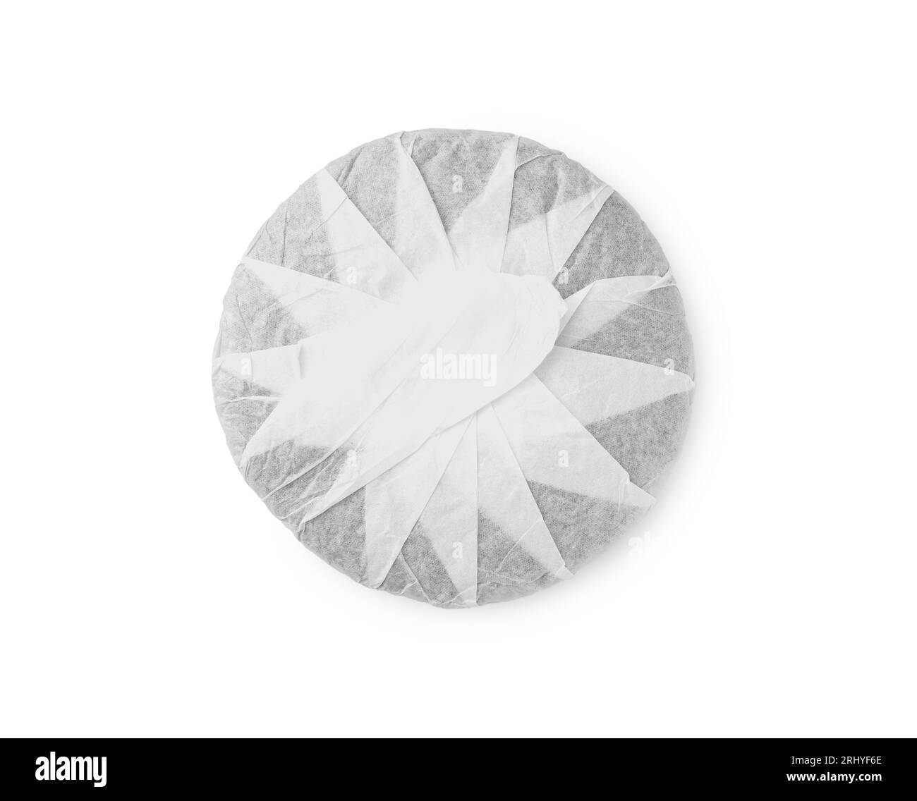 Disc shaped traditional Chinese pu-erh tea in paper wrap isolated on ...