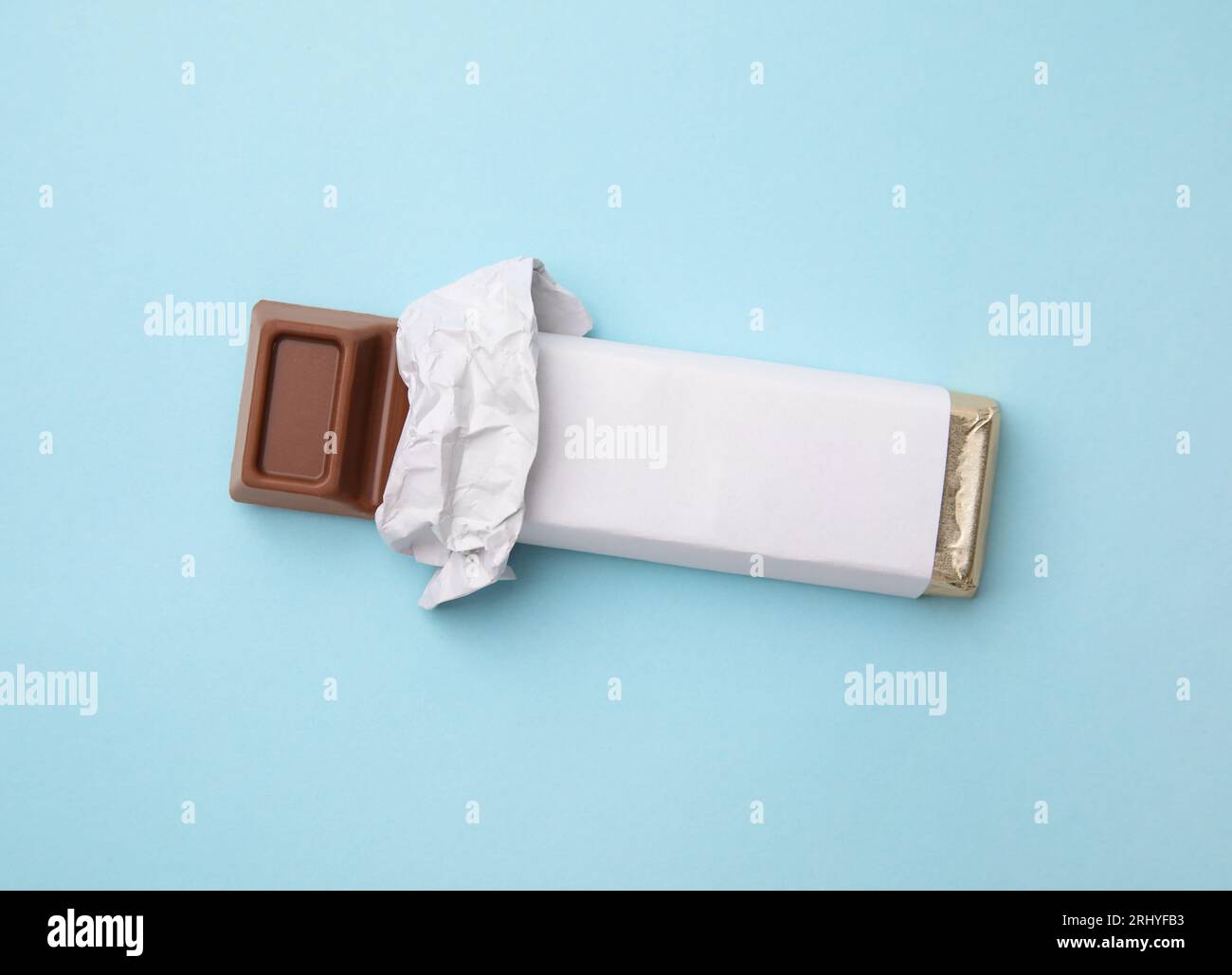 Tasty chocolate bar in package on light blue background, top view Stock ...