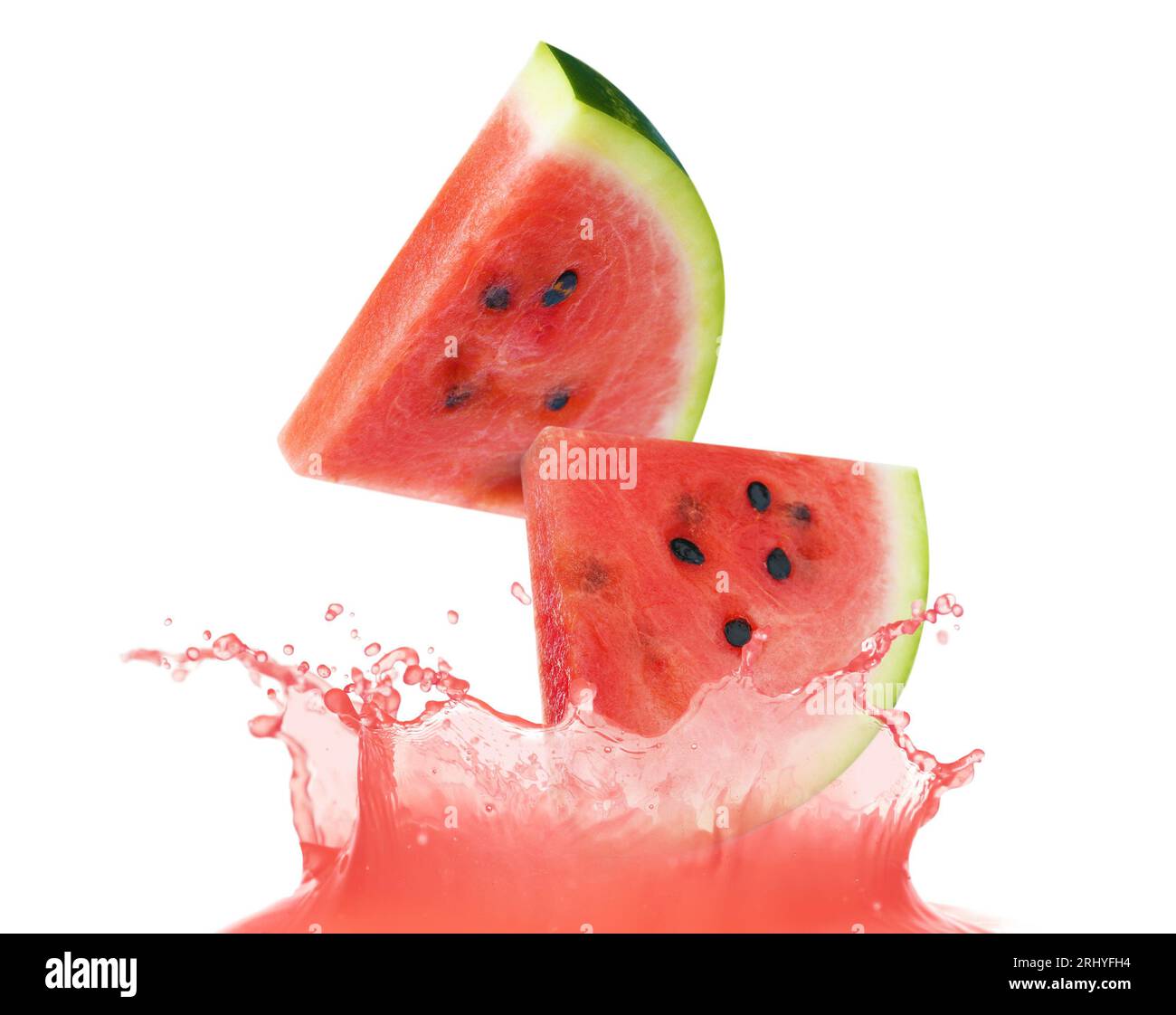 Cut watermelon falling into juice on white background Stock Photo - Alamy