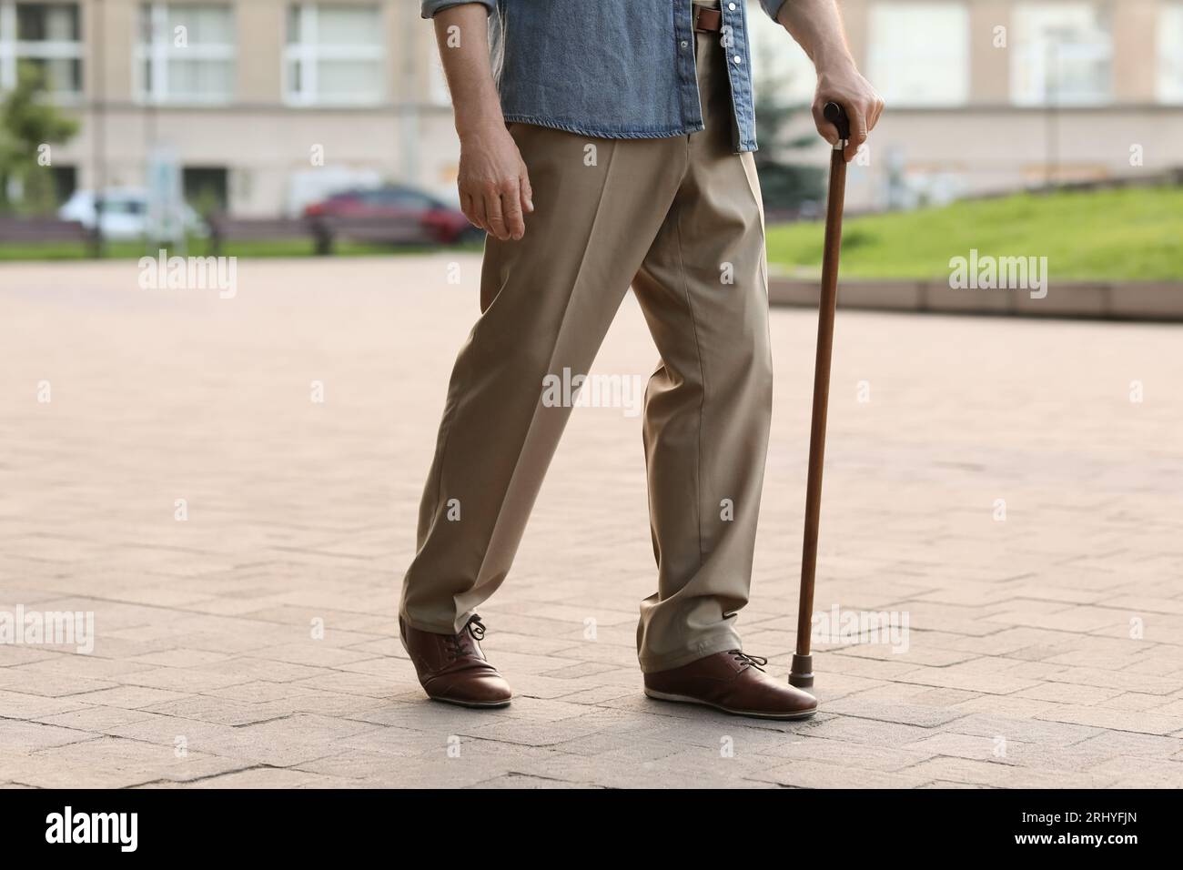 Senior man with walking cane outdoors, closeup Stock Photo - Alamy