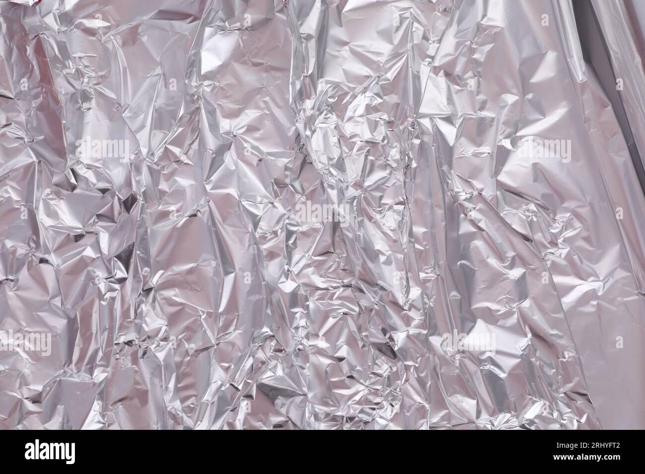 One sheet of crumpled aluminum foil as background, closeup Stock Photo ...