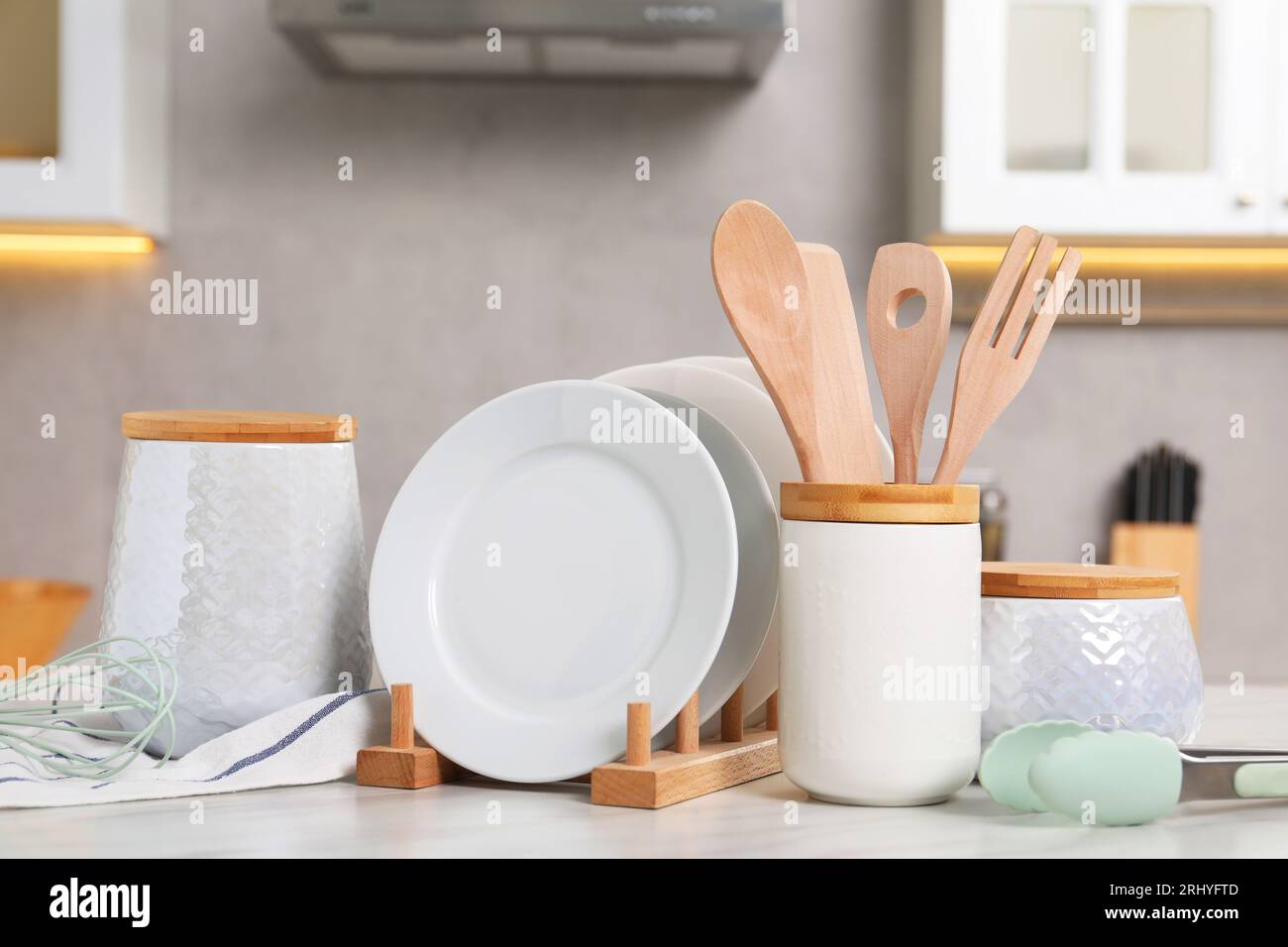 Set of different kitchenware on white table at home Stock Photo - Alamy