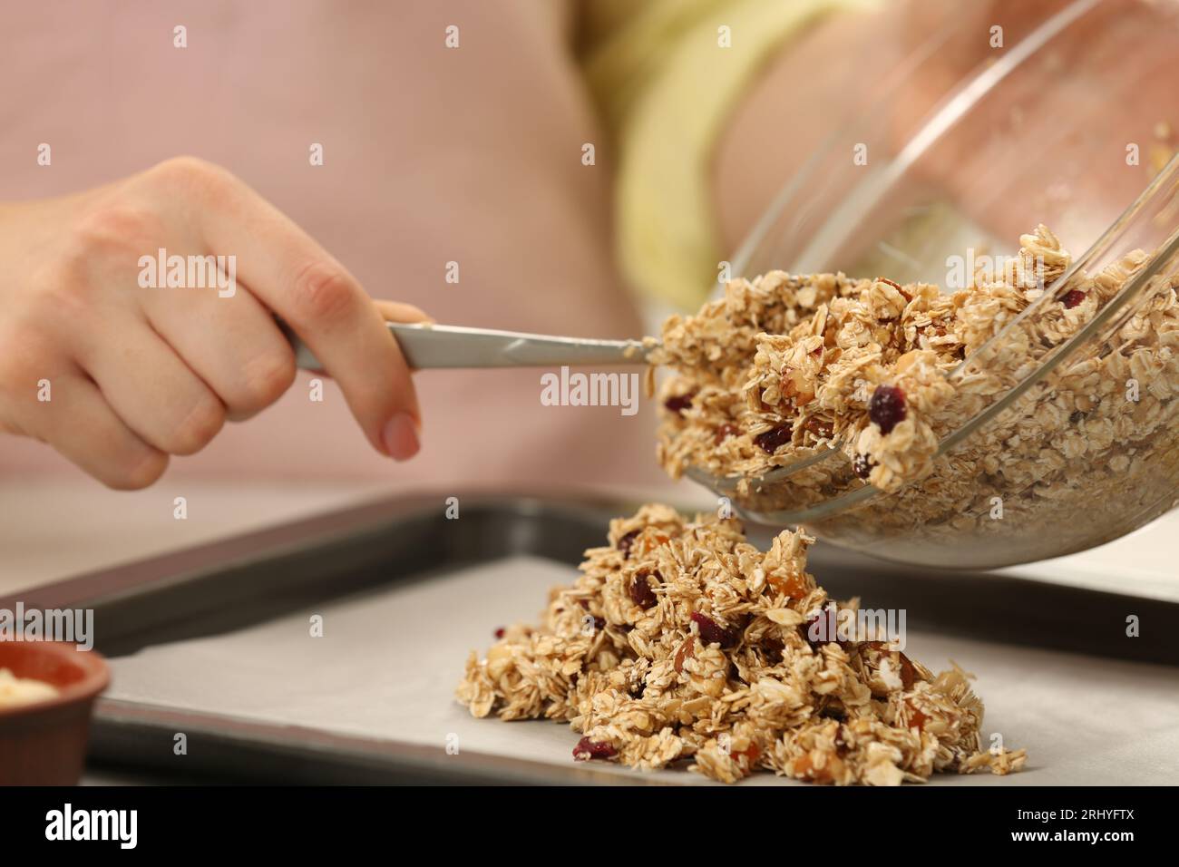 Woman putting baking tray oat hi-res stock photography and images - Alamy