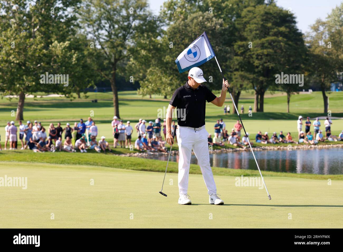 OLYMPIA FIELDS, IL - AUGUST 19: PGA golfer Matt Fitzpatrick puts the flag in on the 18th hole ...