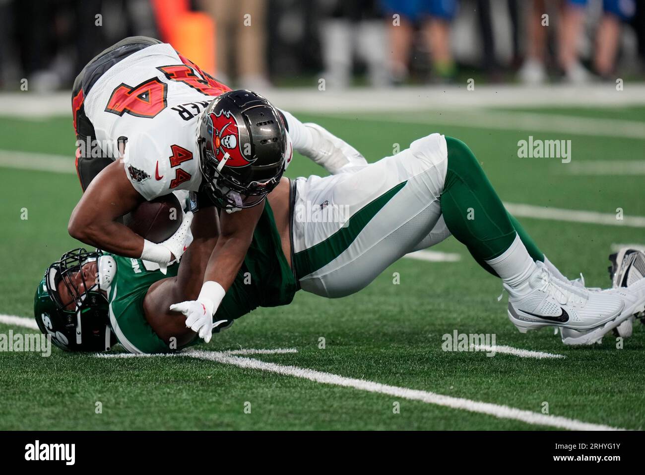 New York Jets defensive tackle Al Woods, below, tackles Tampa Bay ...