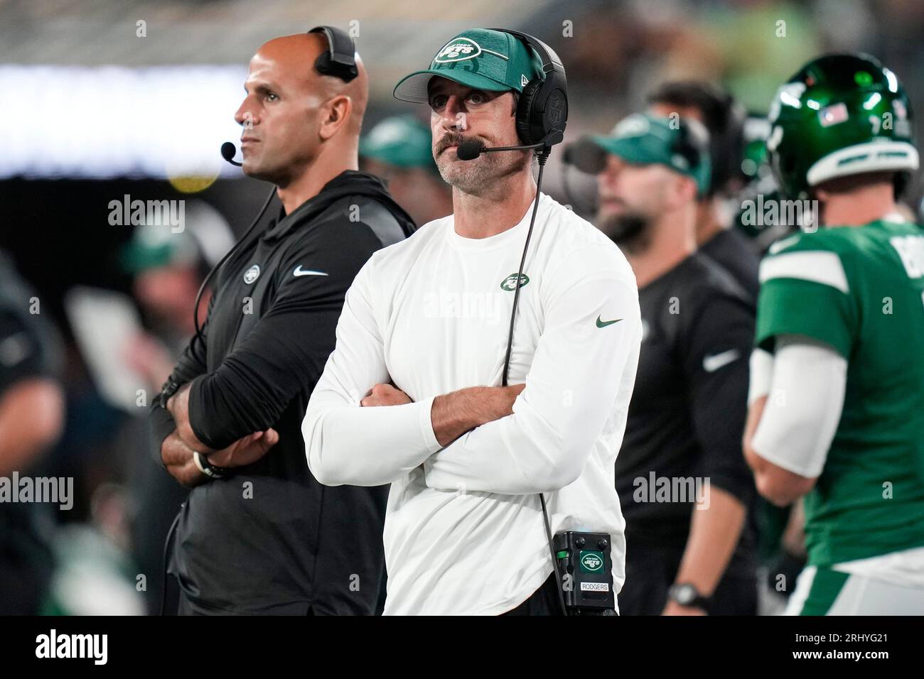 New York Jets quarterback Aaron Rodgers, right, watchs his team with ...