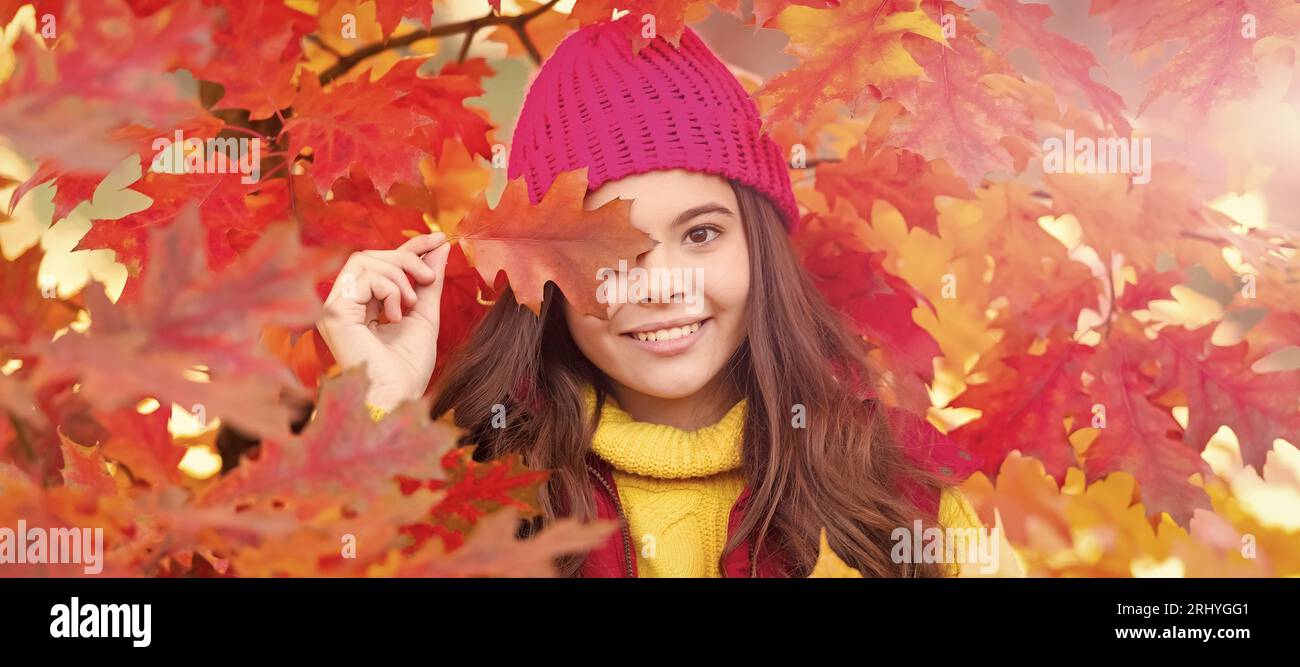 happy teen girl in hat with autumn colorful oak tree leaves, fall ...