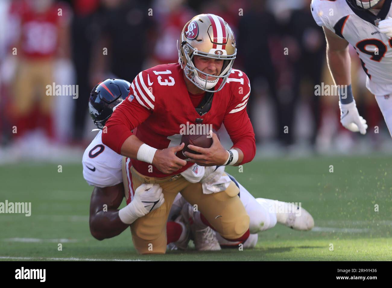San Francisco 49ers quarterback Brock Purdy (13) is sacked by Denver ...