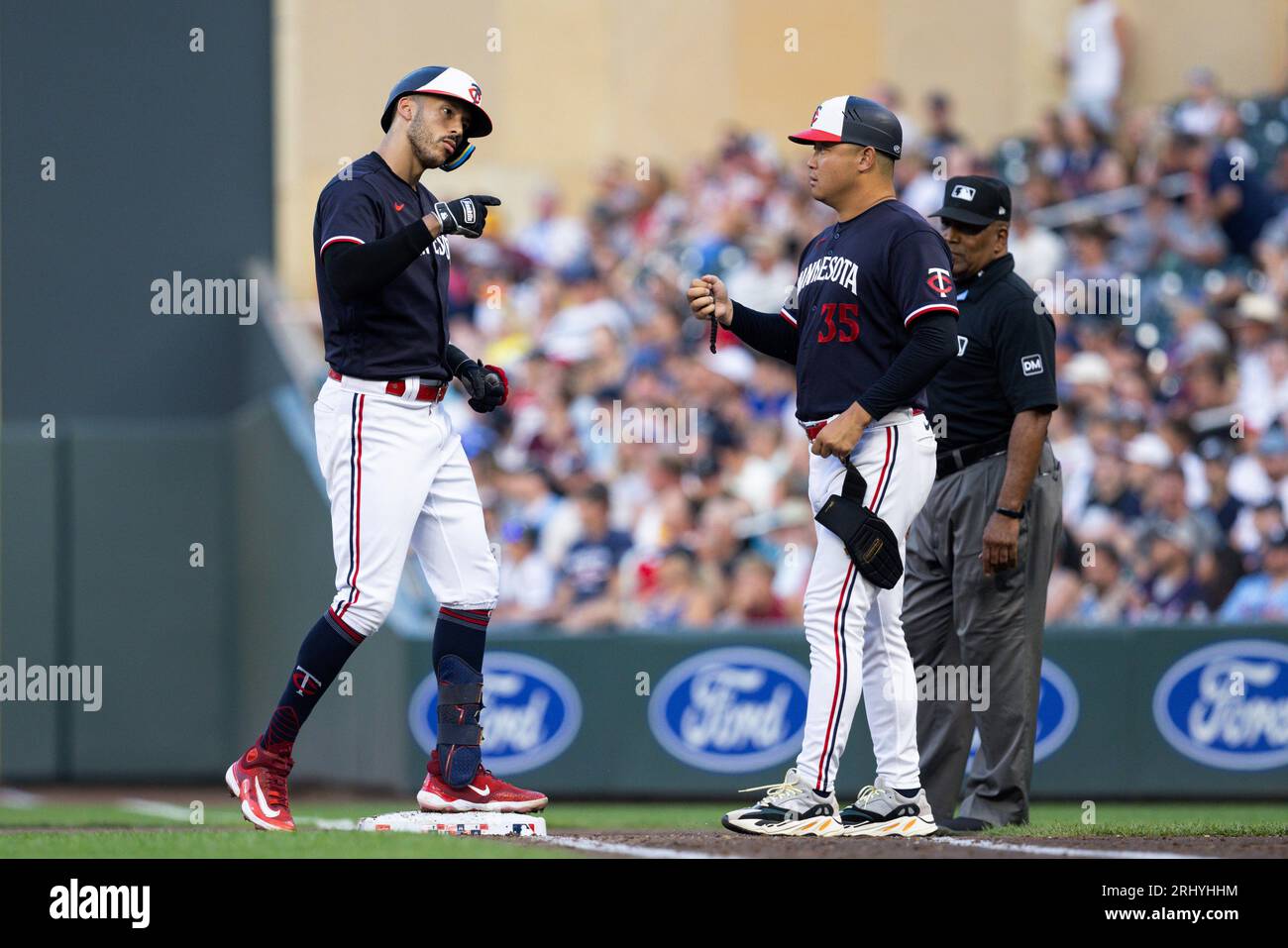 Minnesota Twins' Carlos Correa celebrates with first base coach Hank ...