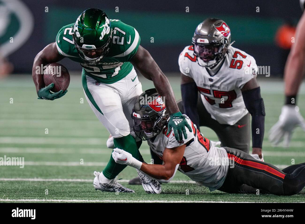 New York Jets' Zonovan Knight (27) is tackled by Tampa Bay Buccaneers ...