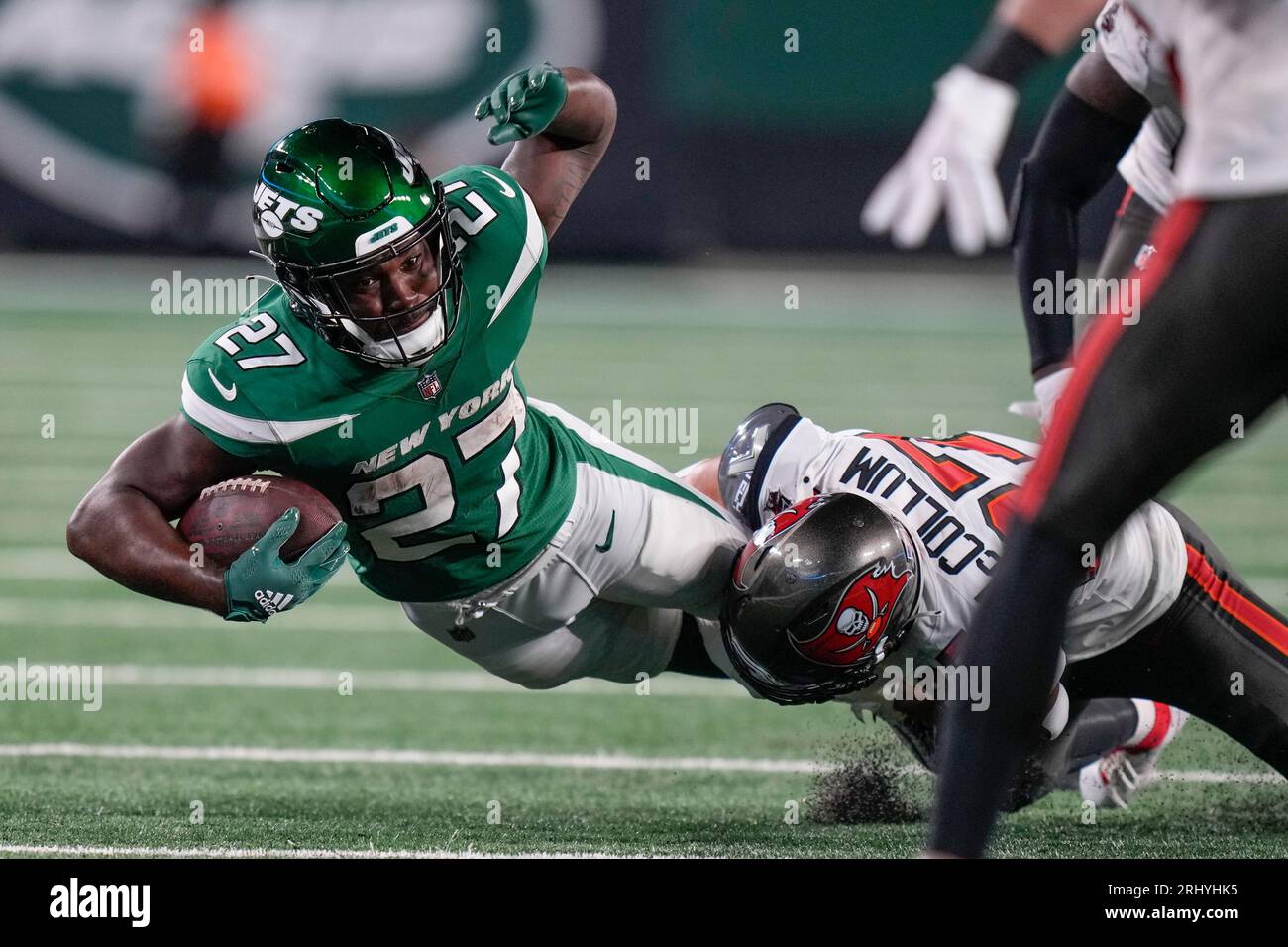 New York Jets' Zonovan Knight (27) is tackled by Tampa Bay Buccaneers ...